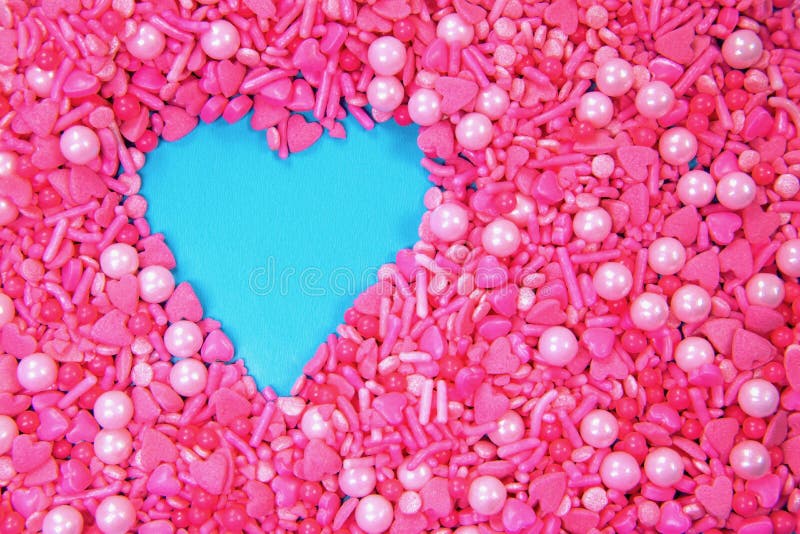 Full Frame Pink Heart Sprinkles and a Turquoise Heart Shape Stock Image ...