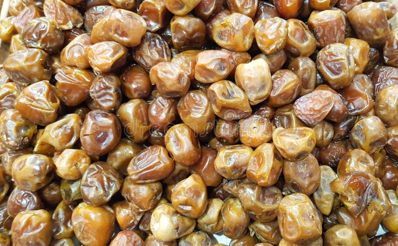 Full Frame Top View of a Stack of Mouthwatering Honey Dried Dates Stock ...