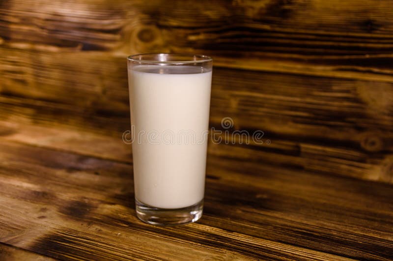Full Glass of Milk on a Wooden Table Stock Photo - Image of beverage ...