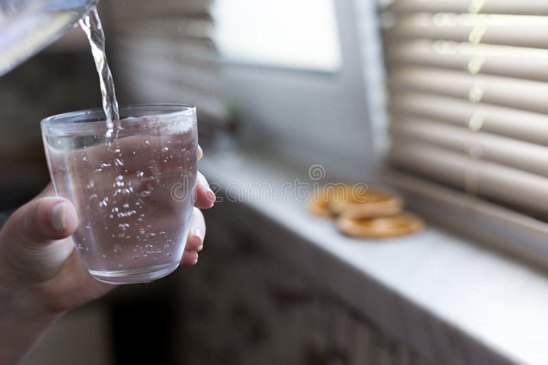 Full Glass of Water. Water Flow Fallen into the Glass Stock Photo ...