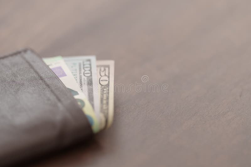 Full Grain Leather Wallet with Currency on Walnut Table Stock Photo ...