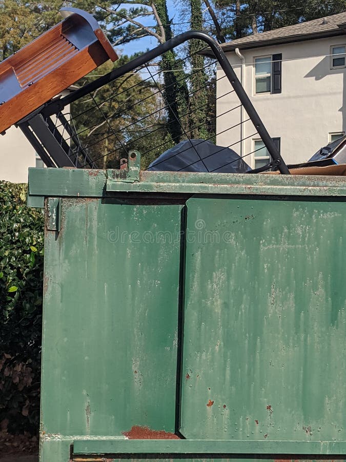 Full green dumpster stock image. Image of wood, fence - 203826025