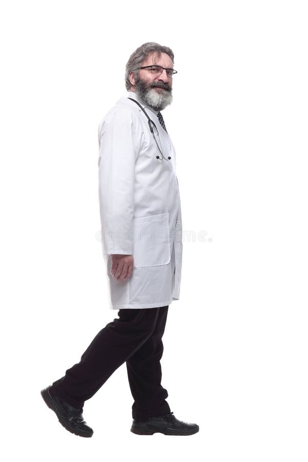 In Full Growth. Confident Male Doctor Striding Forward Stock Photo ...