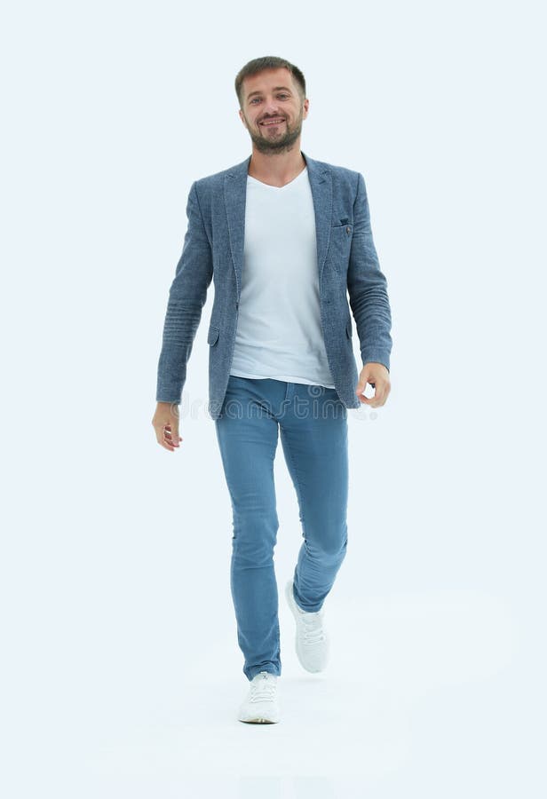 In Full Growth. Confident Young Man Striding Forward Stock Photo ...
