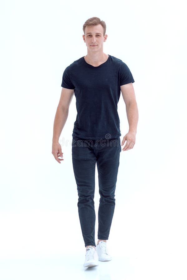 In Full Growth. Confident Young Man Taking a Step Forward Stock Photo ...