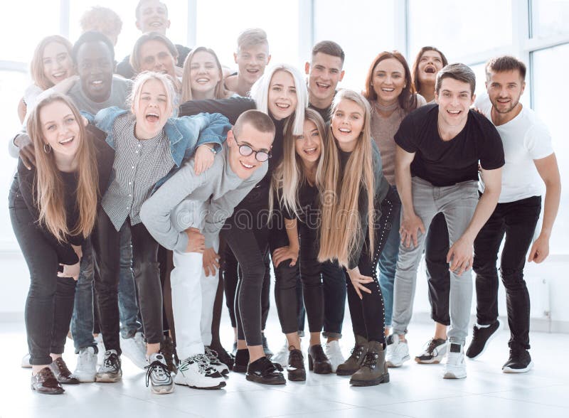 In Full Growth. Group of Cheerful Friends Standing Together Stock Photo ...