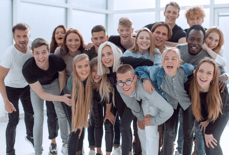 In Full Growth. Happy Young People Standing Together Stock Photo ...