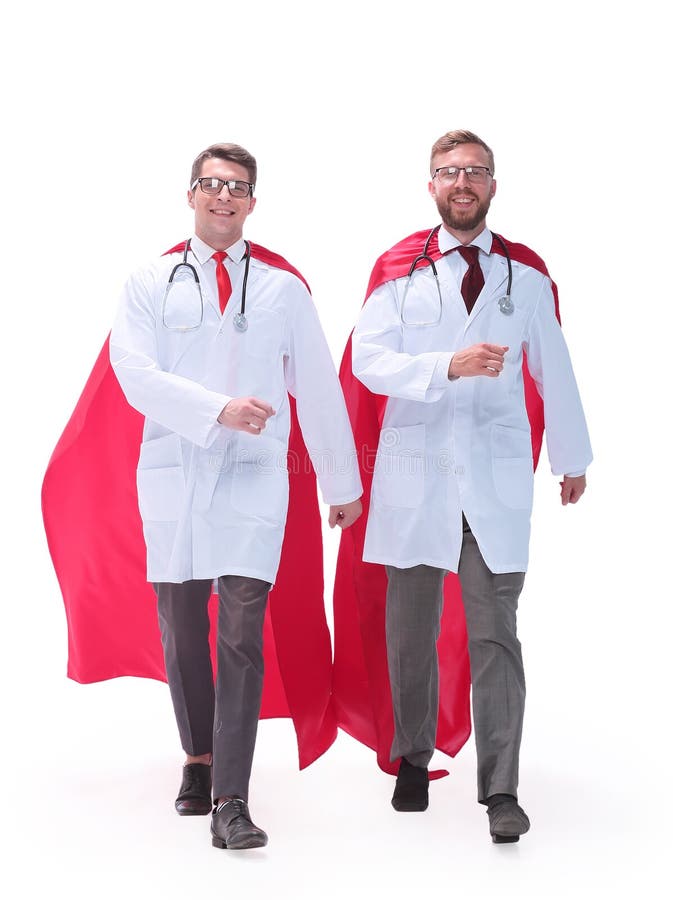In Full Growth. Two Super Doctors Striding Confidently Forward Stock ...