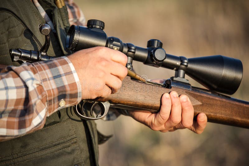 Hunting gear at log cabin stock photo. Image of structure - 12282382