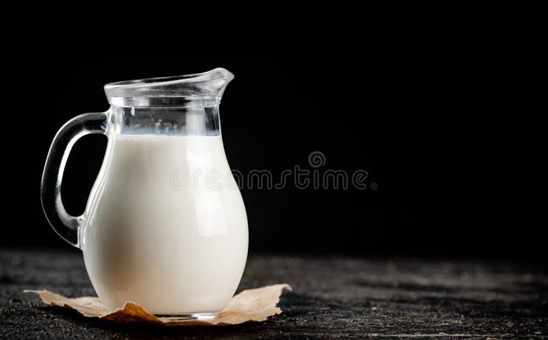 A full jug of fresh milk. stock image. Image of container - 240414695