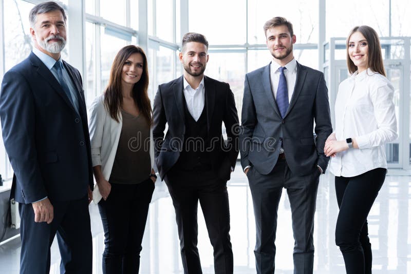 Full Length Confident Business Team Stands in Office. Stock Image ...