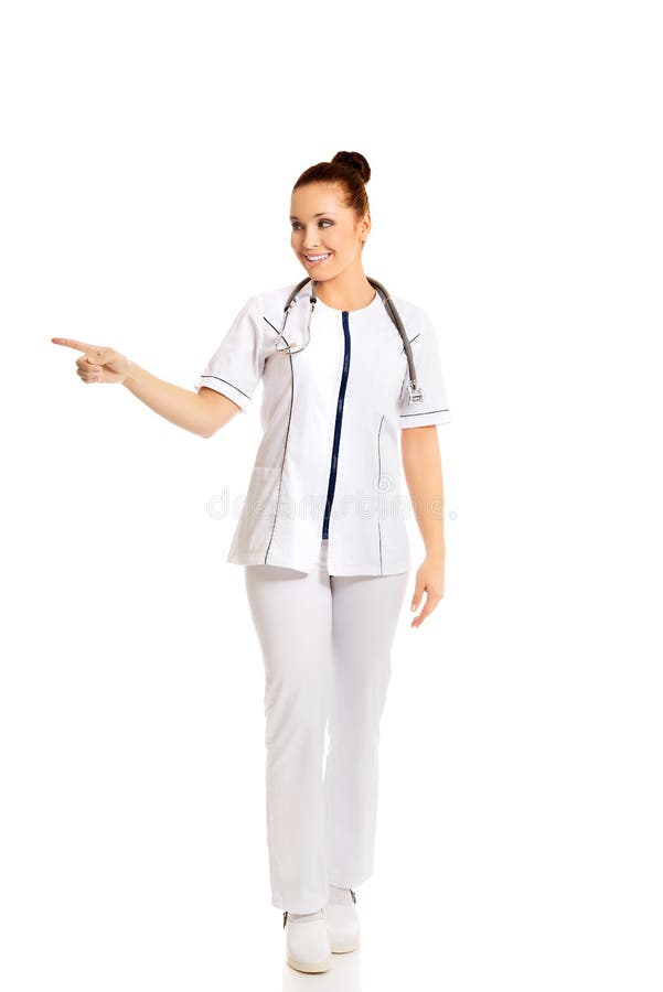 Full Length Female Doctor Pointing To Left Stock Photos - Free ...