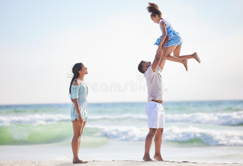 Full Length of a Happy Mixed Race Family Enjoying Family Time Together ... Full Length of a Happy Mixed Race Family Enjoying Family Time Together ...