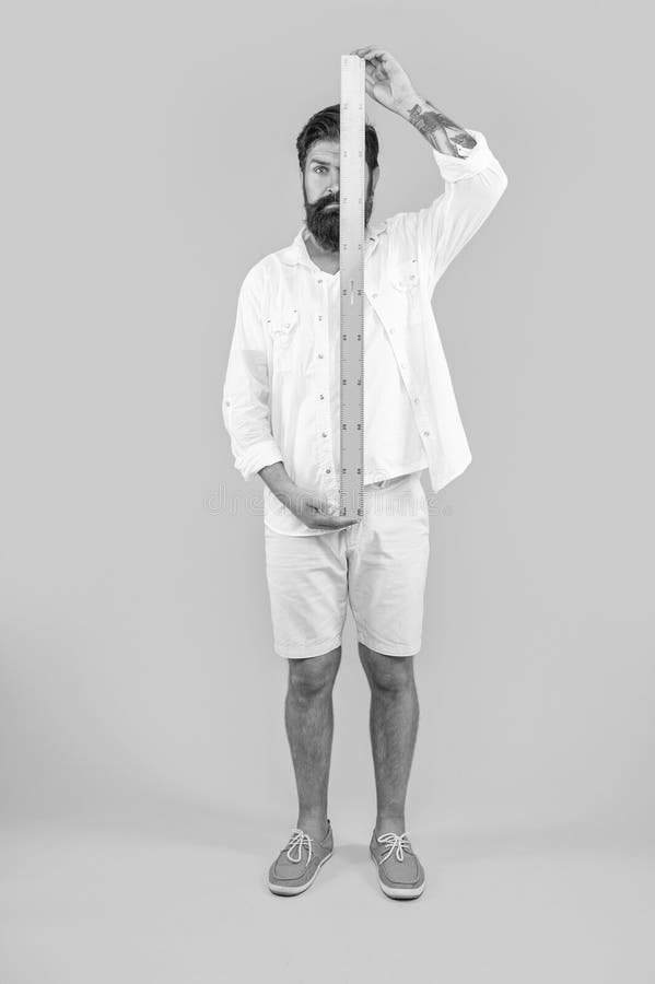 Full Length of Man Hold School Ruler in Studio. Man Hold School Ruler ...