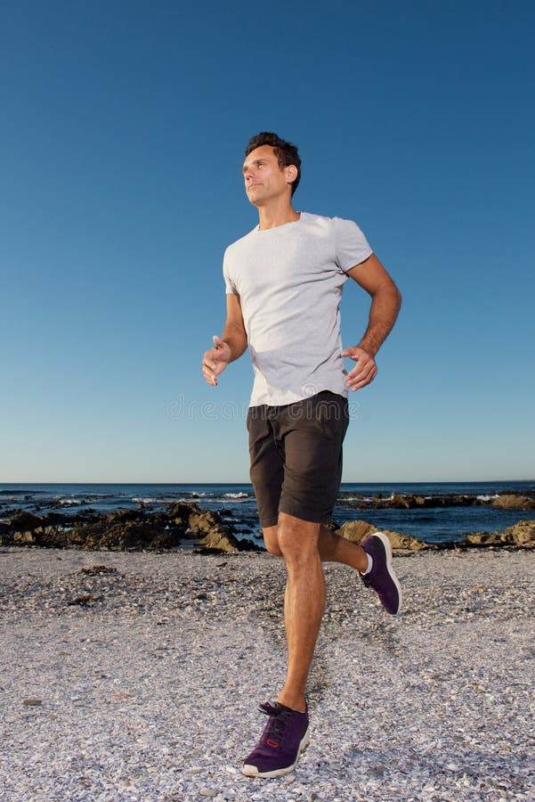 Full Length Middle Age Man Running on Beach Stock Image - Image of ...