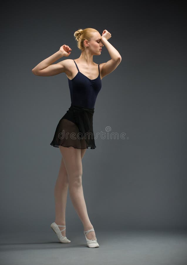 Full Length Portrait Of Dancing Ballerina With Hands On Hips Stock