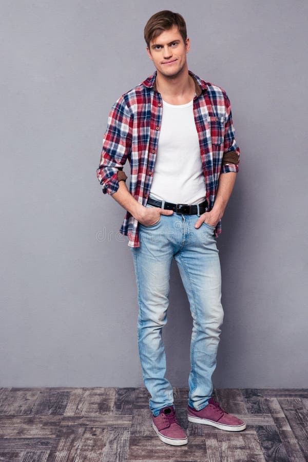 Full Length Portrait Of Handsome Confident Man In Checkered Shirt Stock