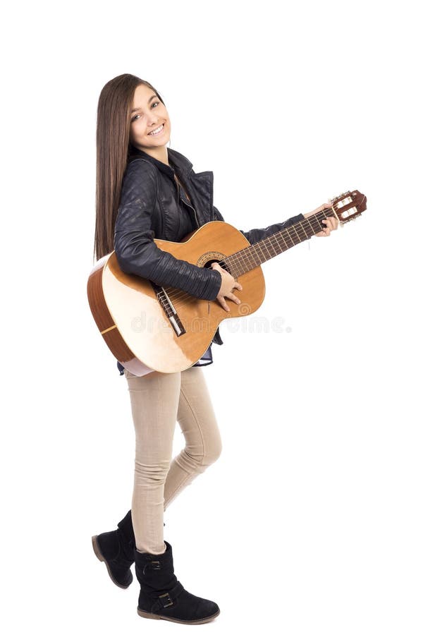 Full Length Portrait Of Happy Teenage Girl Playing Guitar Stock Image