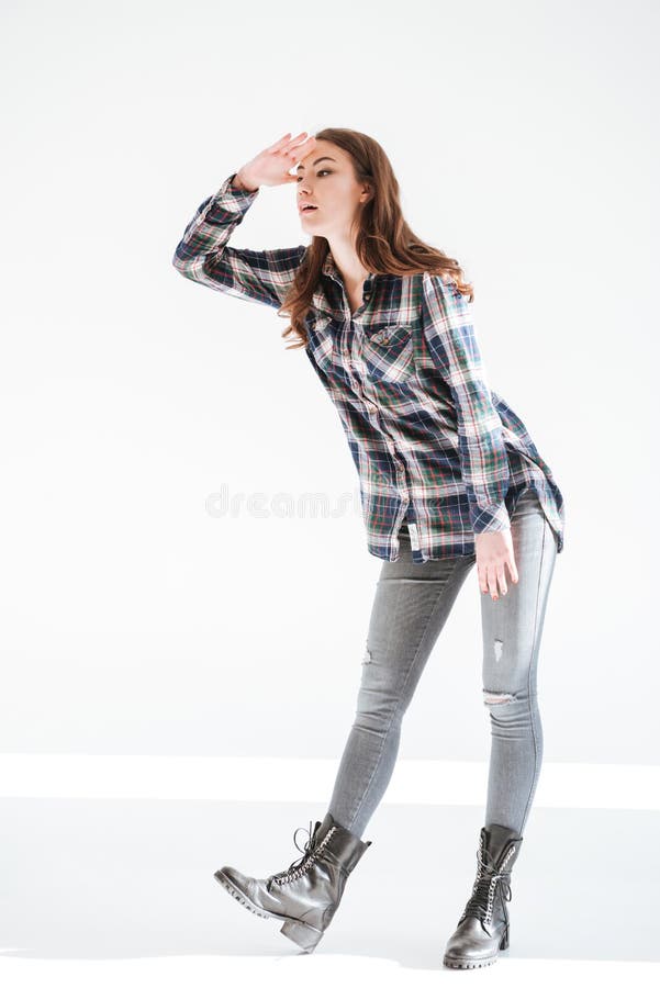 Full Length Of Pretty Woman Standing And Looking Far Away Stock Image