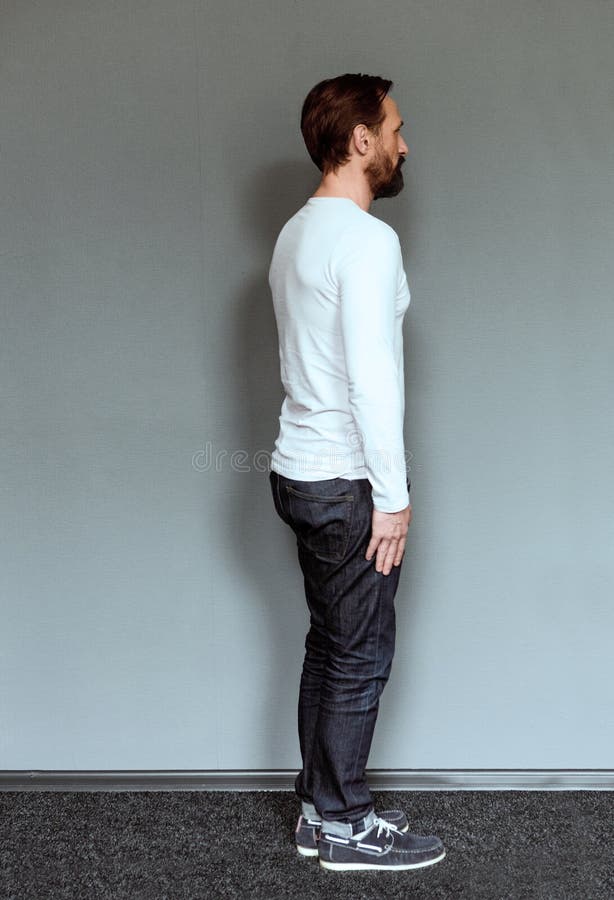 Full Length Profile View of an Actor on Grey Backdrop in Studio. Stock ...