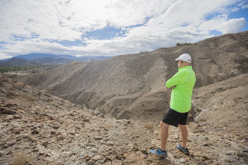 Full Length of Senior Man Looking at View while Standing on Rock Stock ...