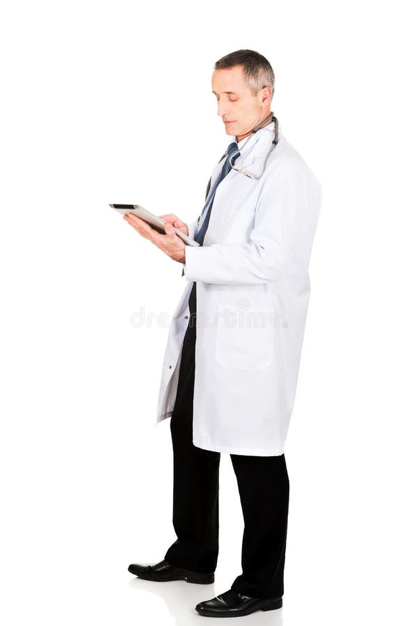Full Length Side View Male Doctor Using a Tablet Stock Photo - Image of ...