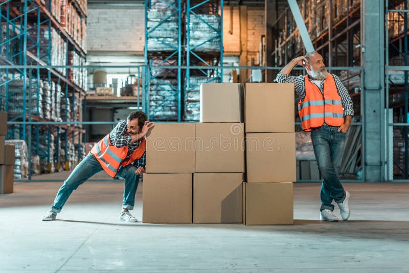 Warehouse Workers Moving Boxes Stock Image - Image of cargo, logistics ...