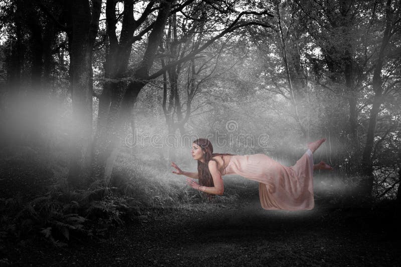 Beautiful Woman Levitation In A Dark Forest Stock Photo - Image of ...