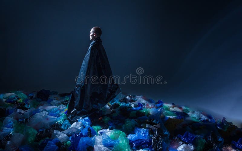 Frame Mage of the Young Man, Surrounded by Empty Plastic Garbage Bags ...