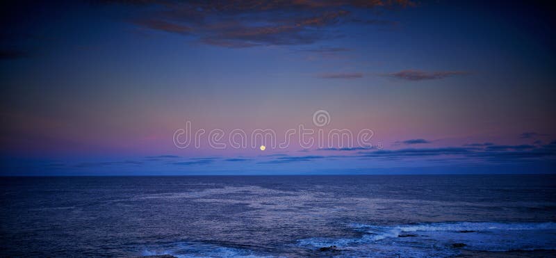 Full moon above the ocean stock image. Image of dawn - 267648089