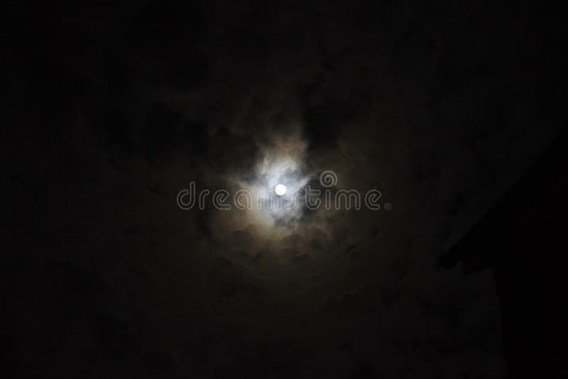 Full Moon Appearing through Clouds at Night Stock Photo - Image of ...