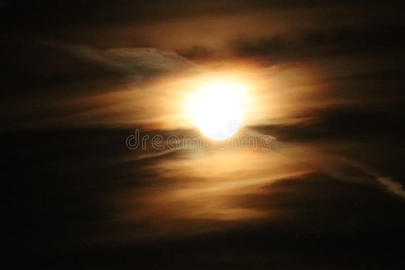 Full Moon Behind a Group of Clouds Over Nebraska Stock Photo - Image of ...