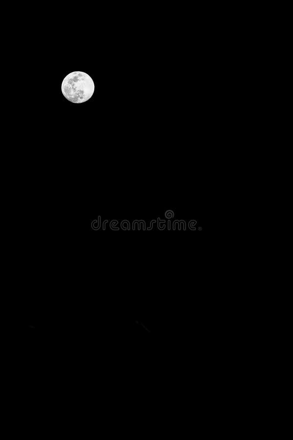 Full Moon on a Black Background with Copy Space, Vertical Stock Photo ...