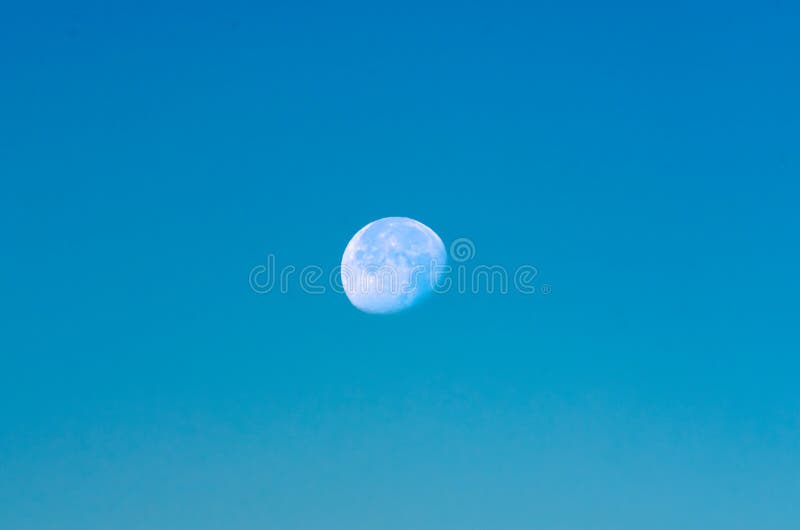 Full Moon Centered in a Clear Blue Evening Sky Stock Photo - Image of ...