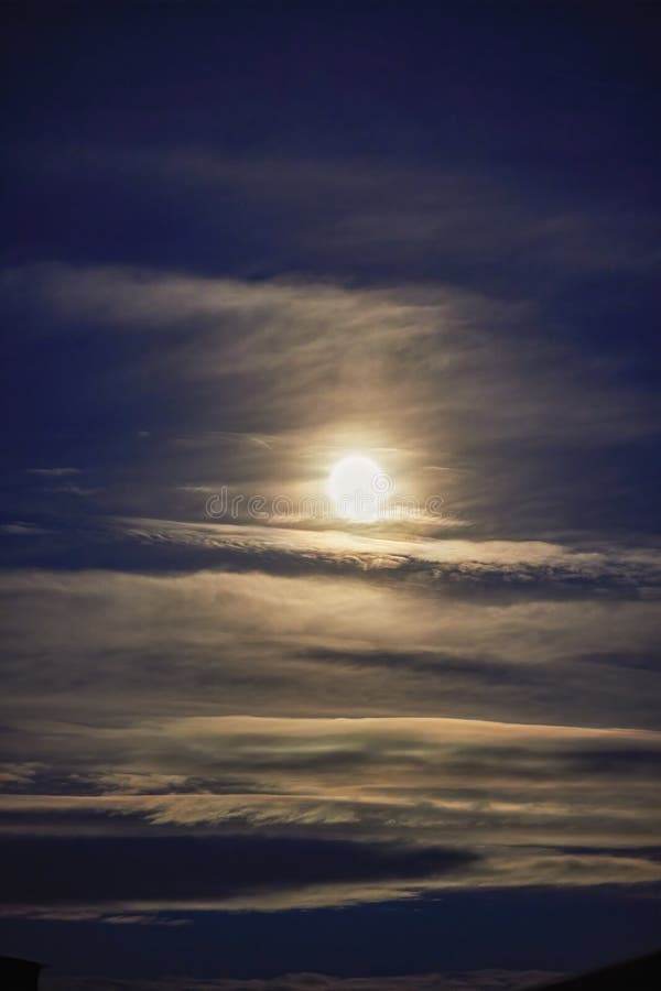 Full Moon on a Cloudy Evening Stock Photo - Image of moonlight, full ...