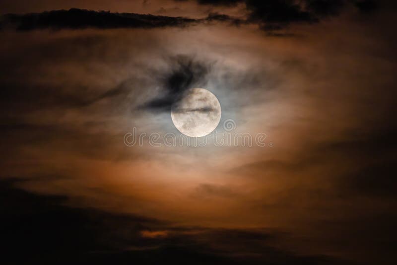 Full Moon on a Cloudy Night. Natural Colored Clouds Around the Moon ...