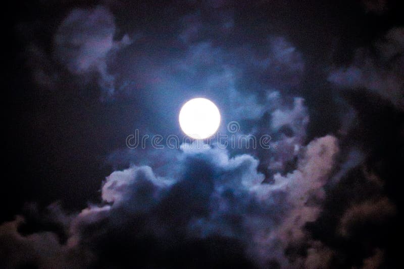 Cloudy full moon stock photo. Image of night, moon, cloudy - 129766936