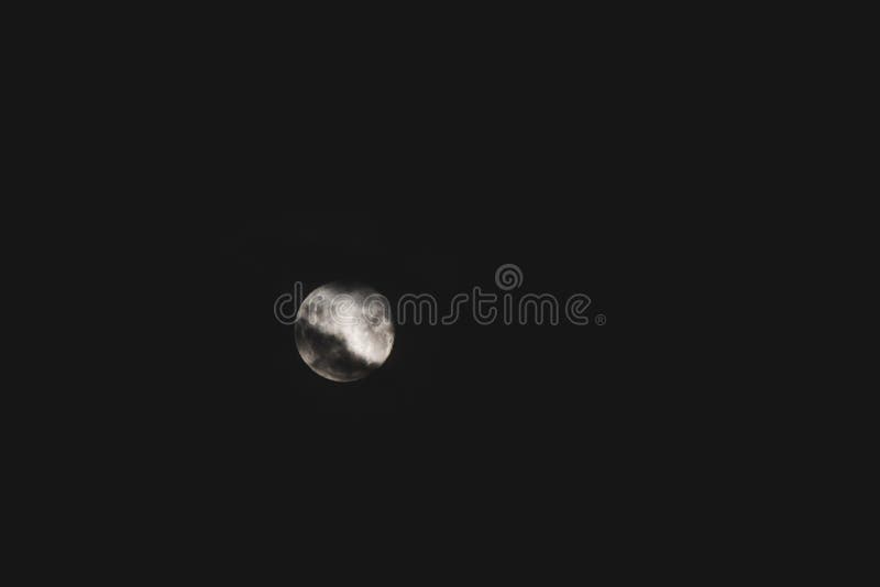 Full Moon with Dark Clouds in Front of it in the Night Sky Stock Photo ...