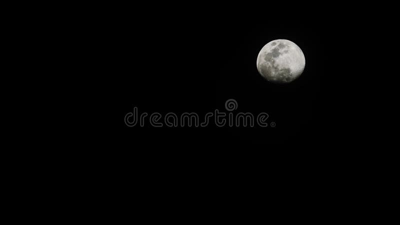 The Full Moon in the Dark Sky at Night Moving Up Fast Stock Footage ...