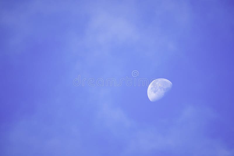The moon in daylight sky stock photo. Image of colour - 154175294