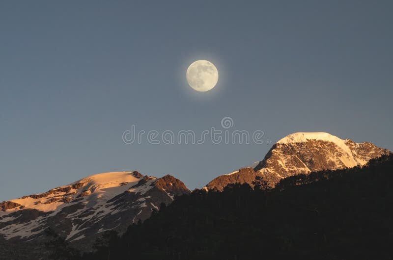 Full Moon in the Mountains. the Moon Illuminates the Snowy Peaks of the ...