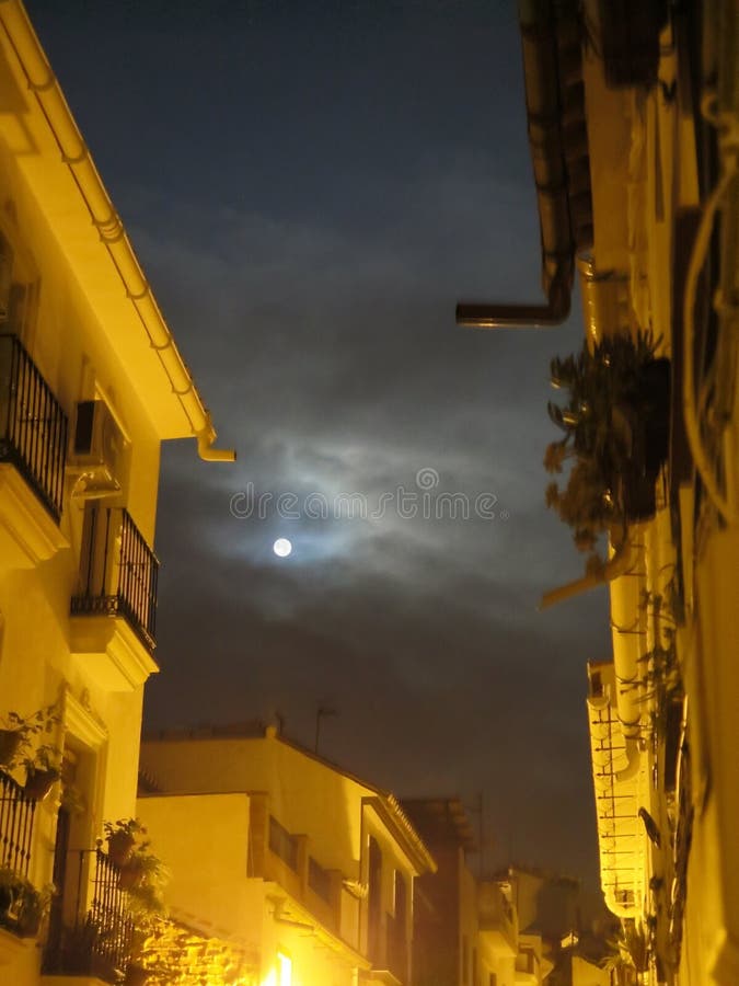 Full Moon Over Alora Street Stock Photo - Image of dawn, celestial ...