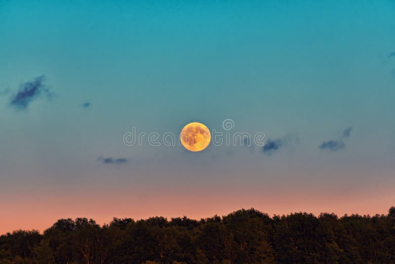 Full Moon Over the Horizon in the Evening Sky Stock Photo - Image of ...
