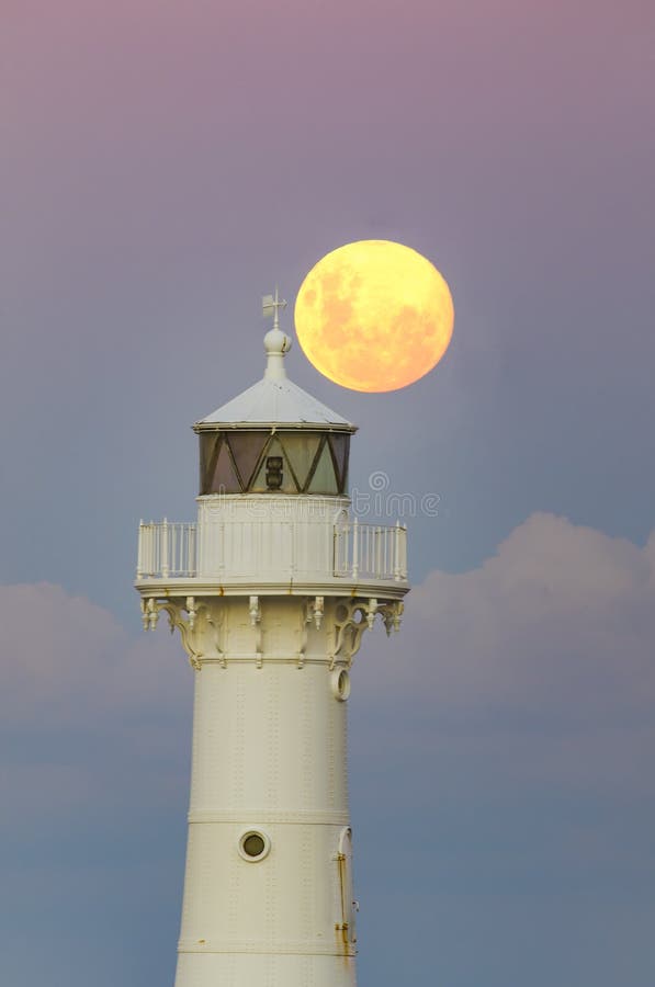 Full Moon Over the Lighthouse Stock Image - Image of rises, lighthouse ...