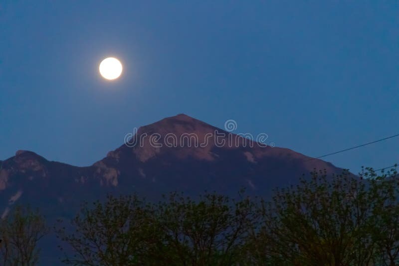 Full moon over mountain stock photo. Image of dramatic - 183928770