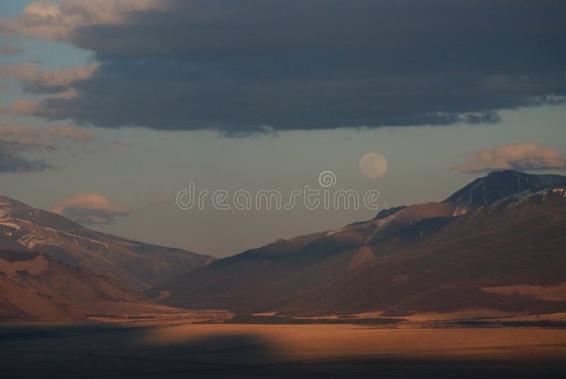 Full Moon Over the Mountains and the Sunset Stock Photo - Image of ...