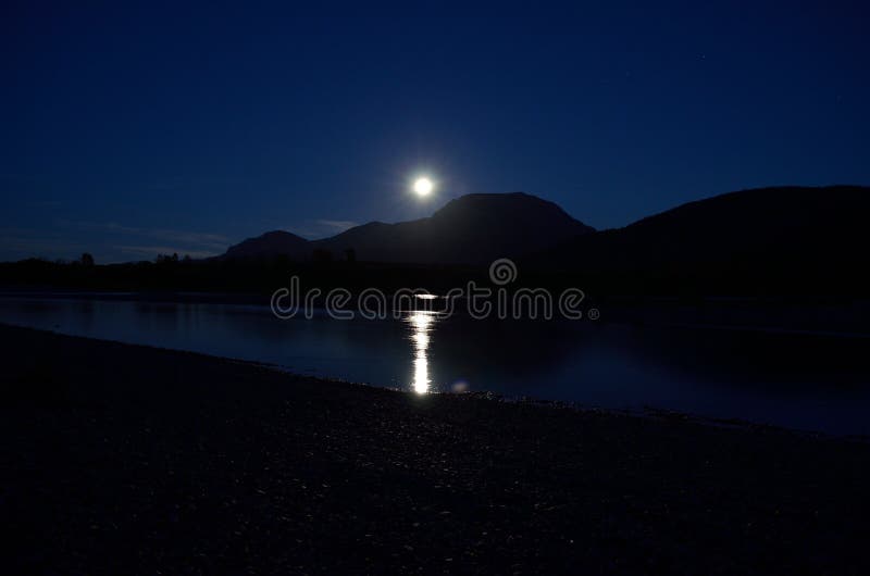 Full Moon Over Night Mountain with Reflection on River Surface Stock ...