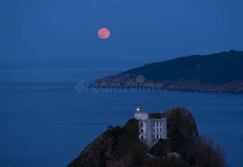 Full Moon Over the Sea and Silver Lighthouse on Mount Ulia, Euskadi ...