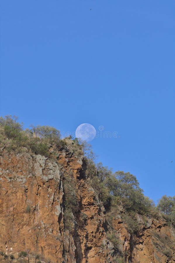Full Moon Setting Behind the Cliffs As Sun Rises in Hell S Gate ...