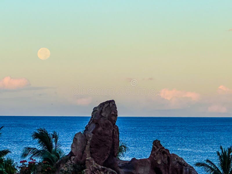 Full Moon Setting during Sunrise Over the Aulani Resort Stock Image ...
